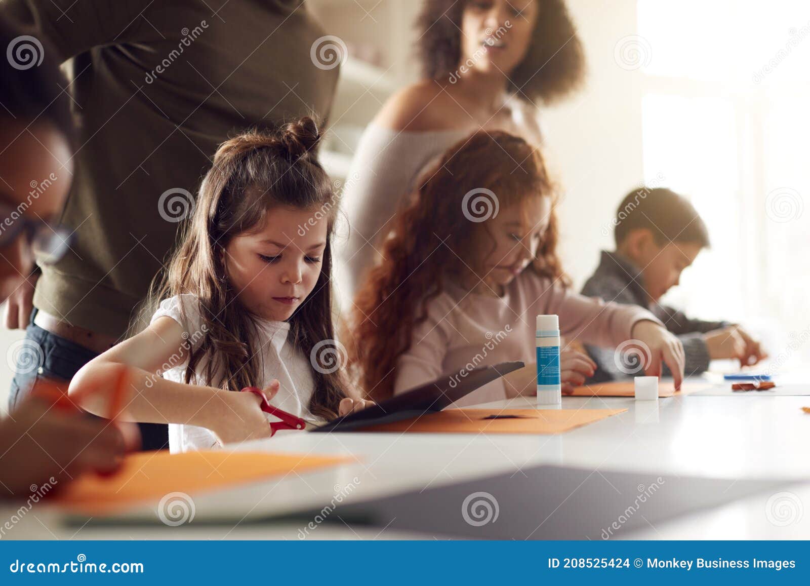 Group of Children at Home with Parents Having Fun Making Craft Together ...