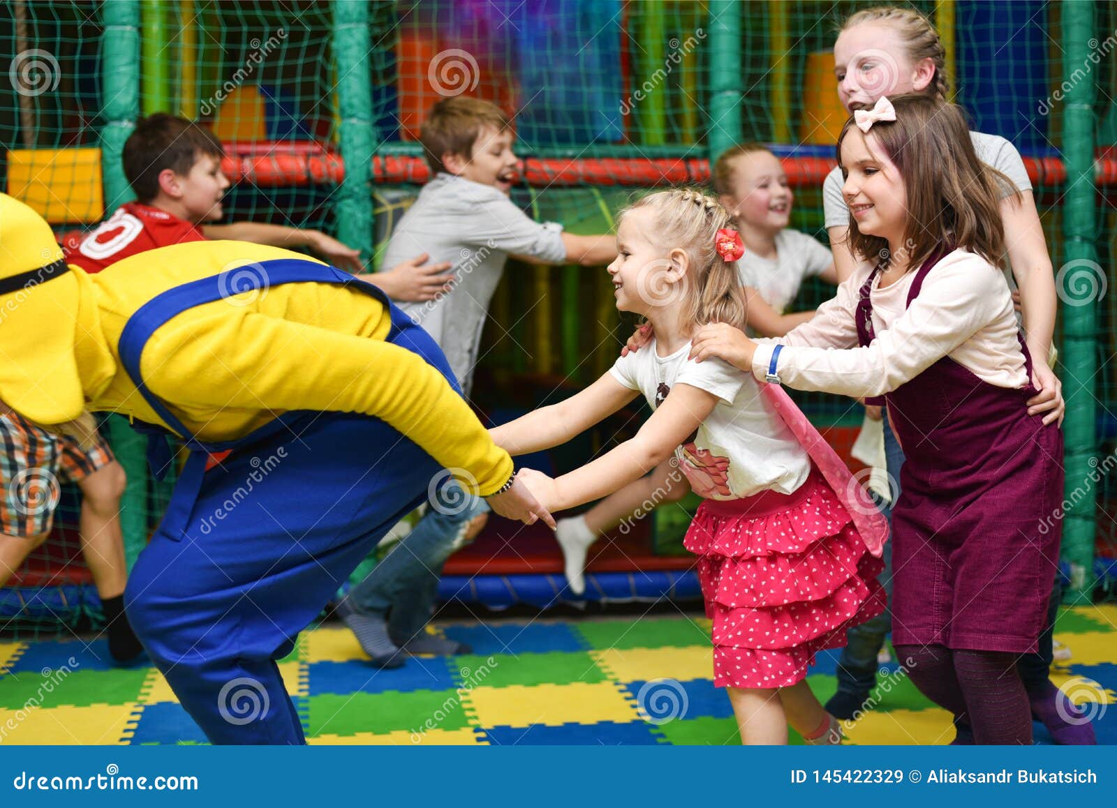 A Group of Children at a Party Play, Run for the Animator and Hold ...
