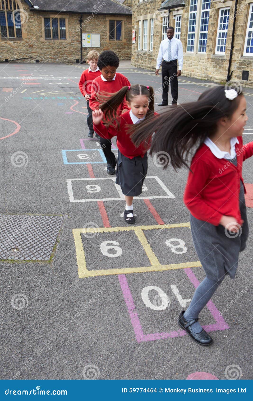 Group of Children Playing Hopscotch in School Playground Stock Photo ...