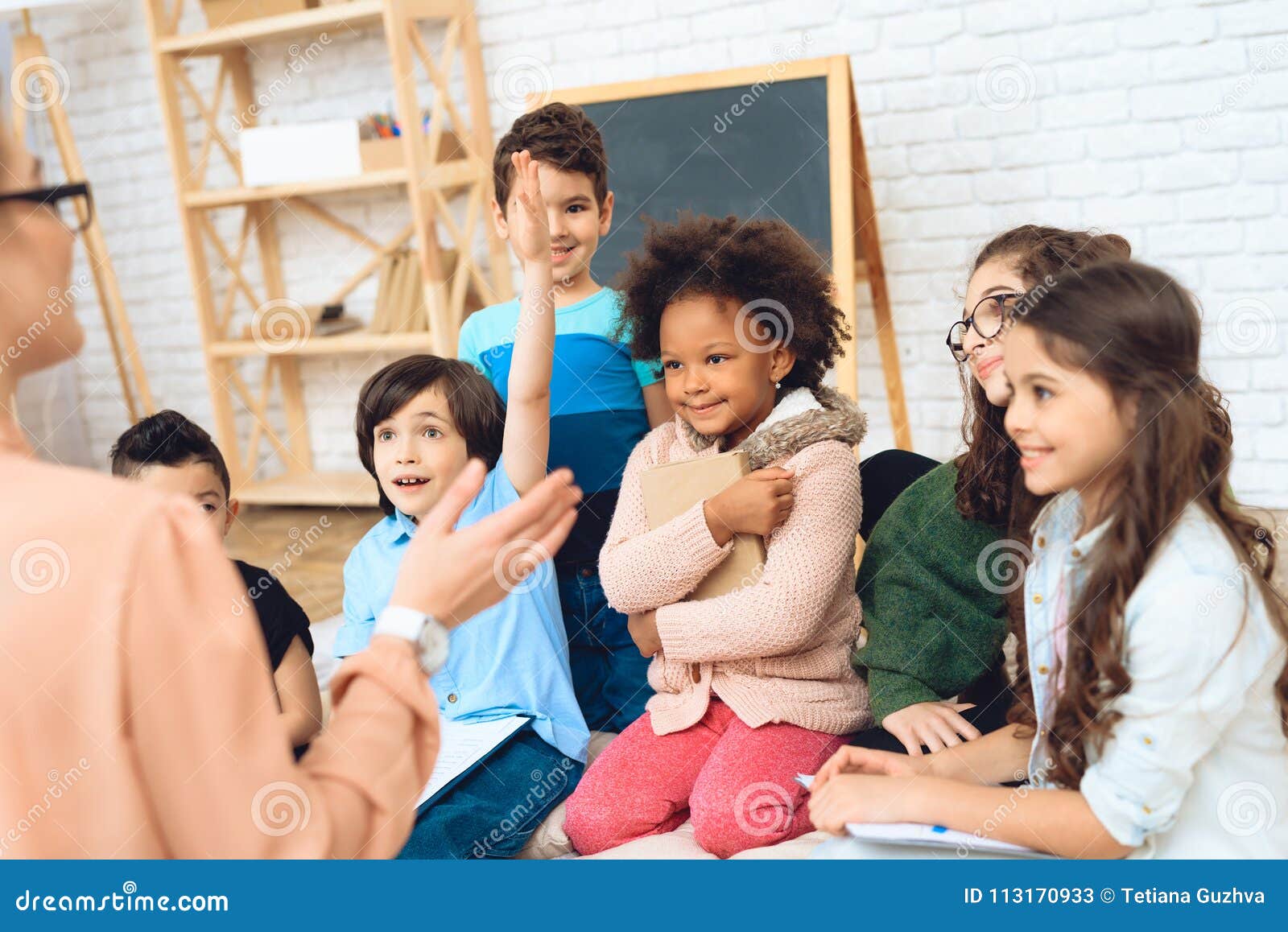 Group of Children are Pulling Hands To Answer Teacher`s Question in ...