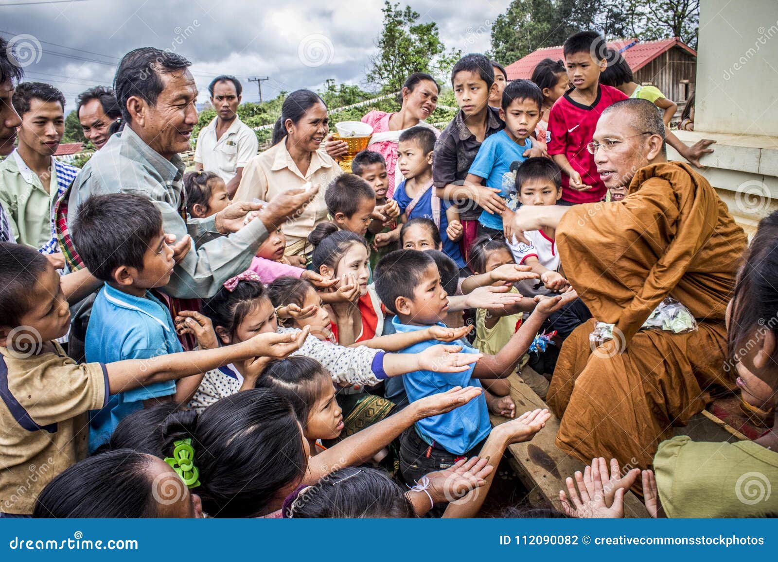 Group Of Children Raising Their Palm Towards A Man Picture. Image ...