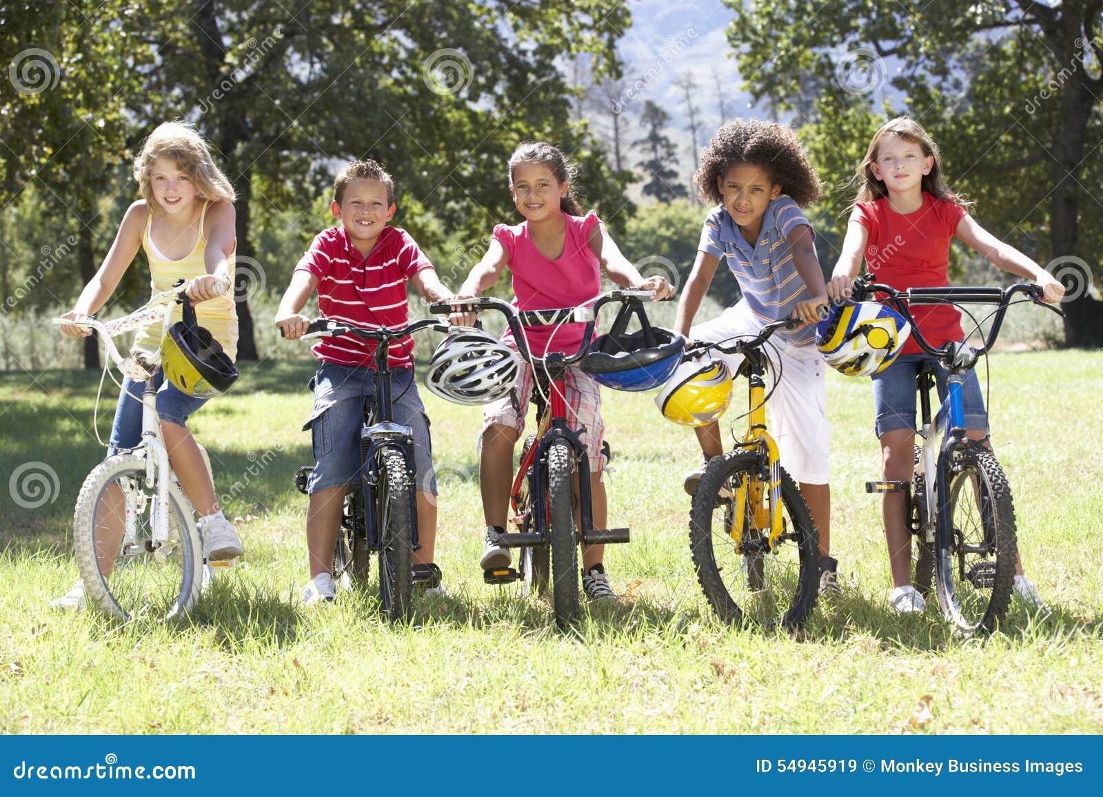 Group of Children Riding Bikes in Countryside Stock Image - Image of ...