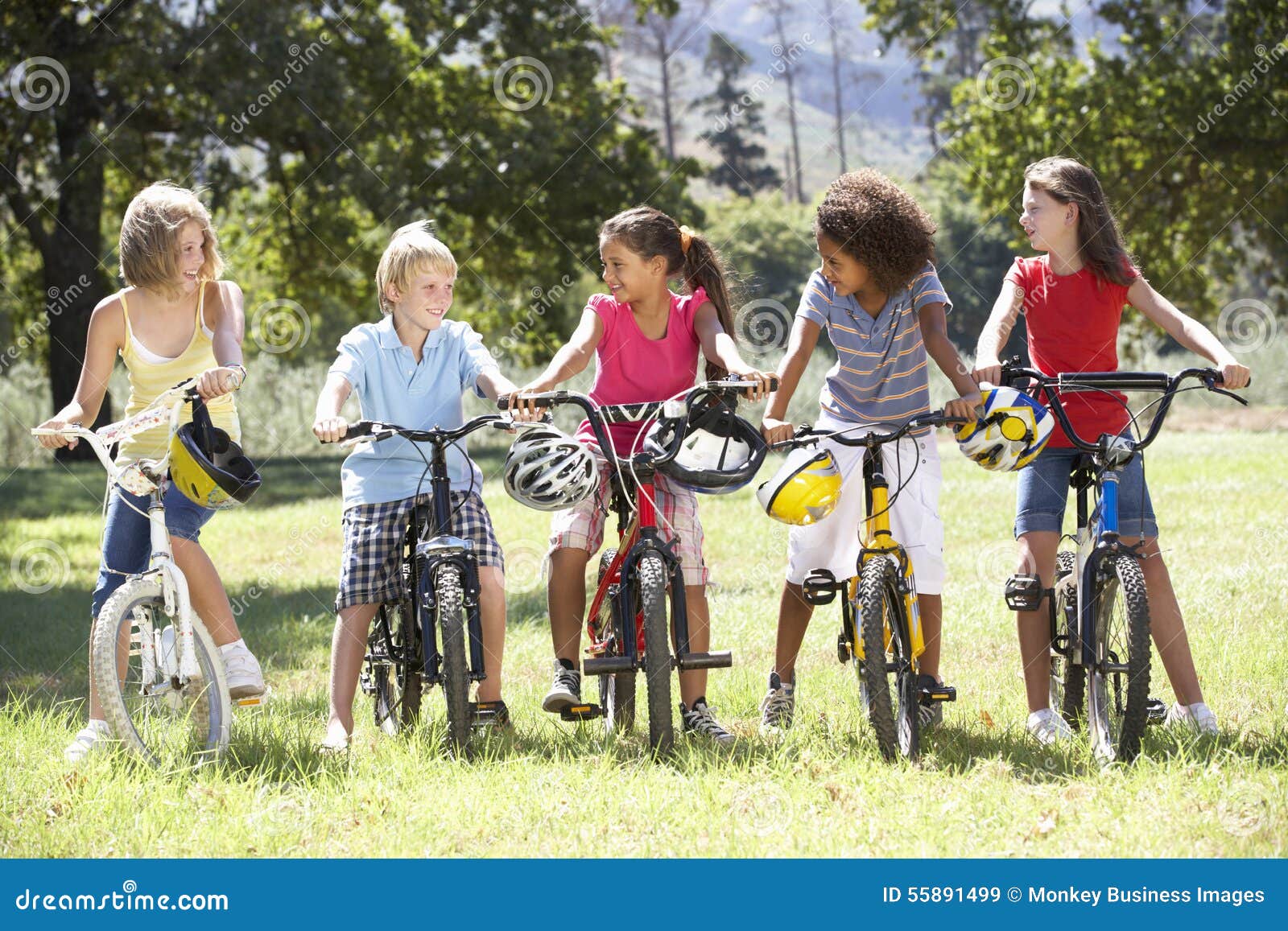 Group Of Children Riding Bikes In Countryside Stock Photo - Image: 55891499