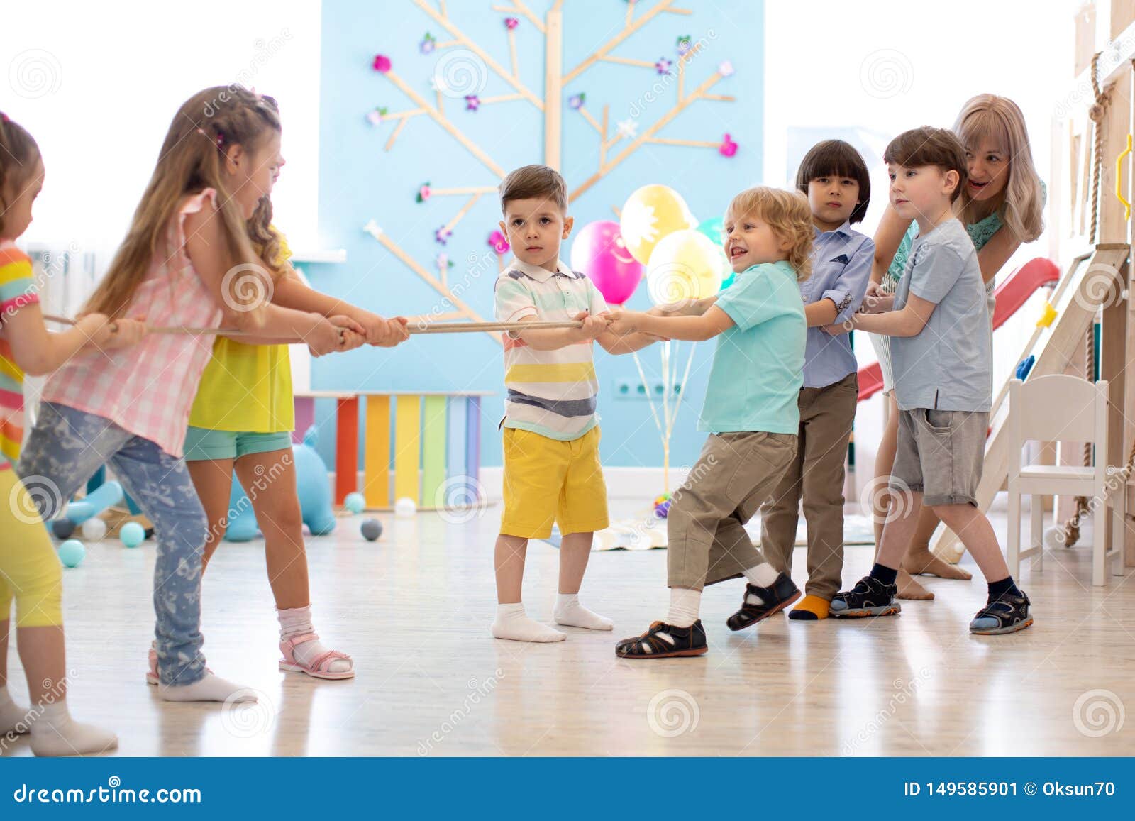 Group of Children in a Rope-pulling Contest in Kindergarten Stock Image ...