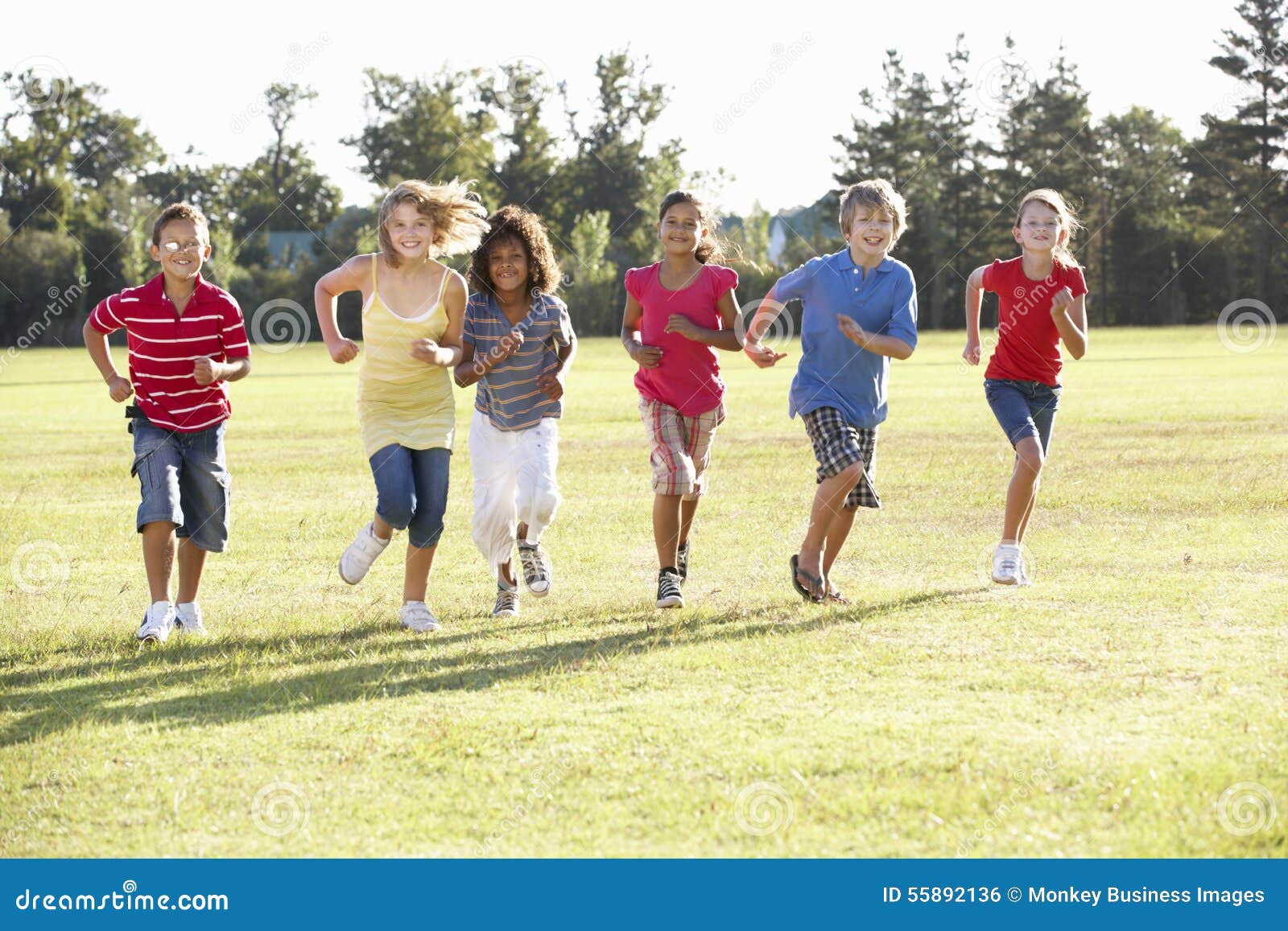 Group of Children Running through Countryside Stock Photo - Image of ...