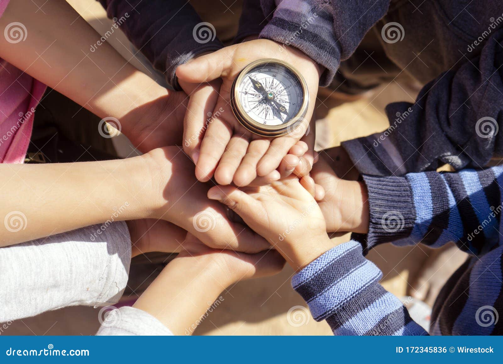 Group of Children S Hands Holding a Compass - Teamwork Concept Stock ...