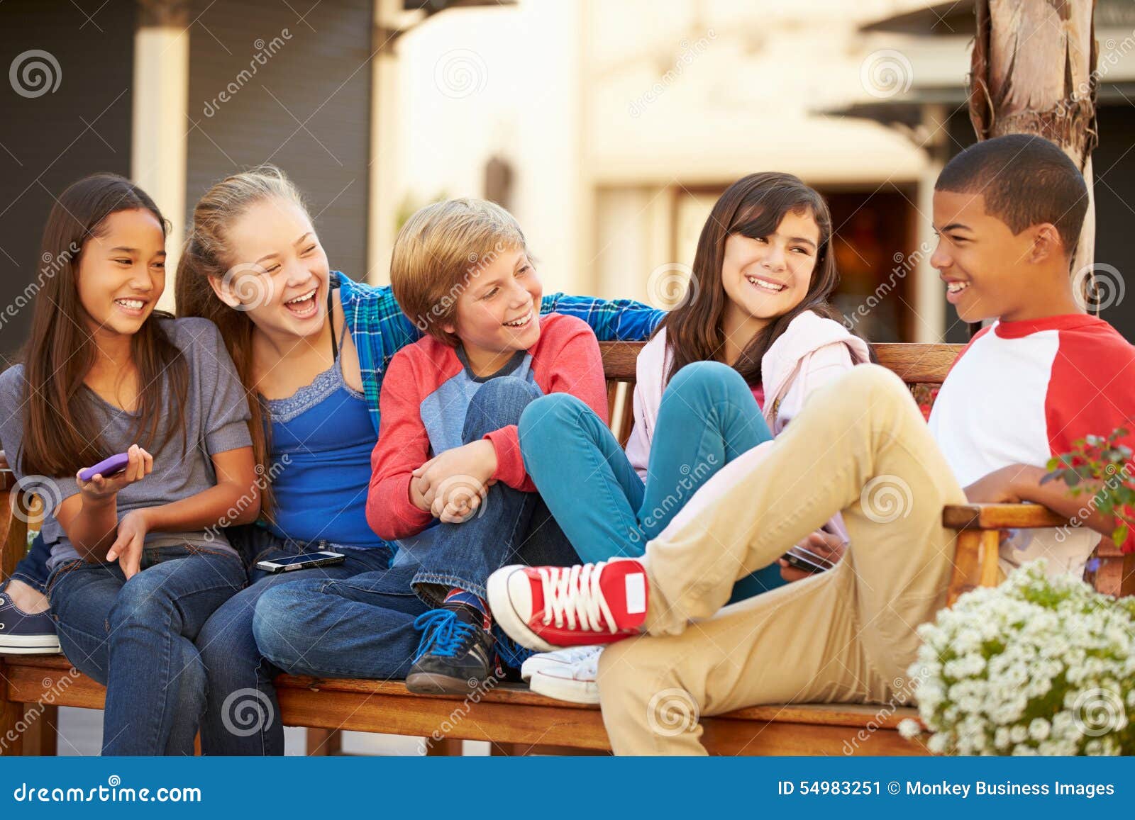 Group of Children Sitting on Bench in Mall Stock Image - Image of ...