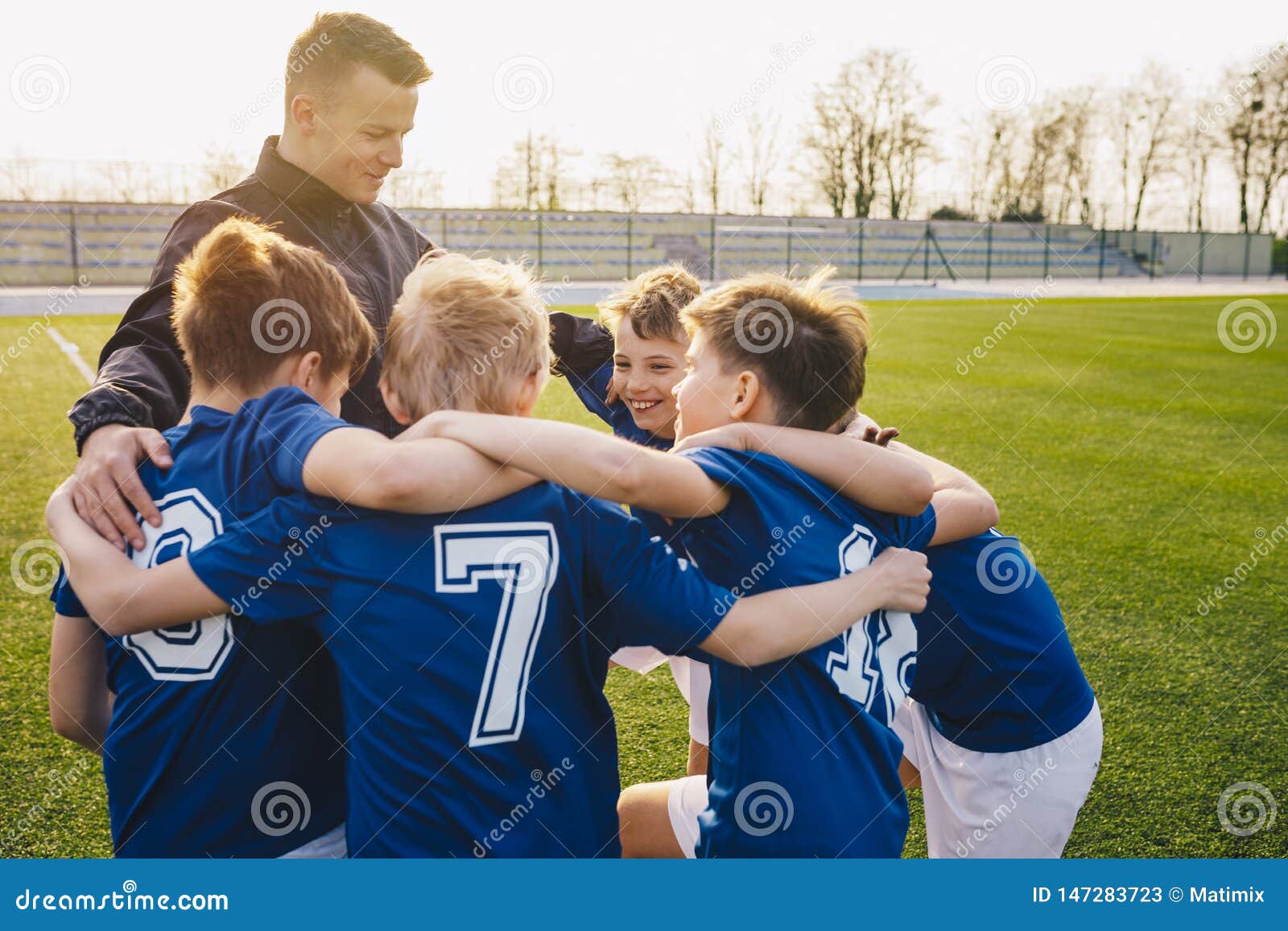 Group of Children in Soccer Team Celebrating with Coach Stock Image ...