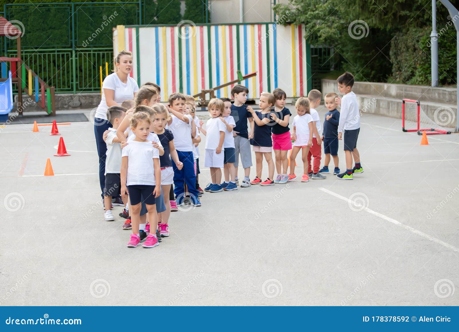 Group of Children Standing in Column and Waiting for Lesson Start ...