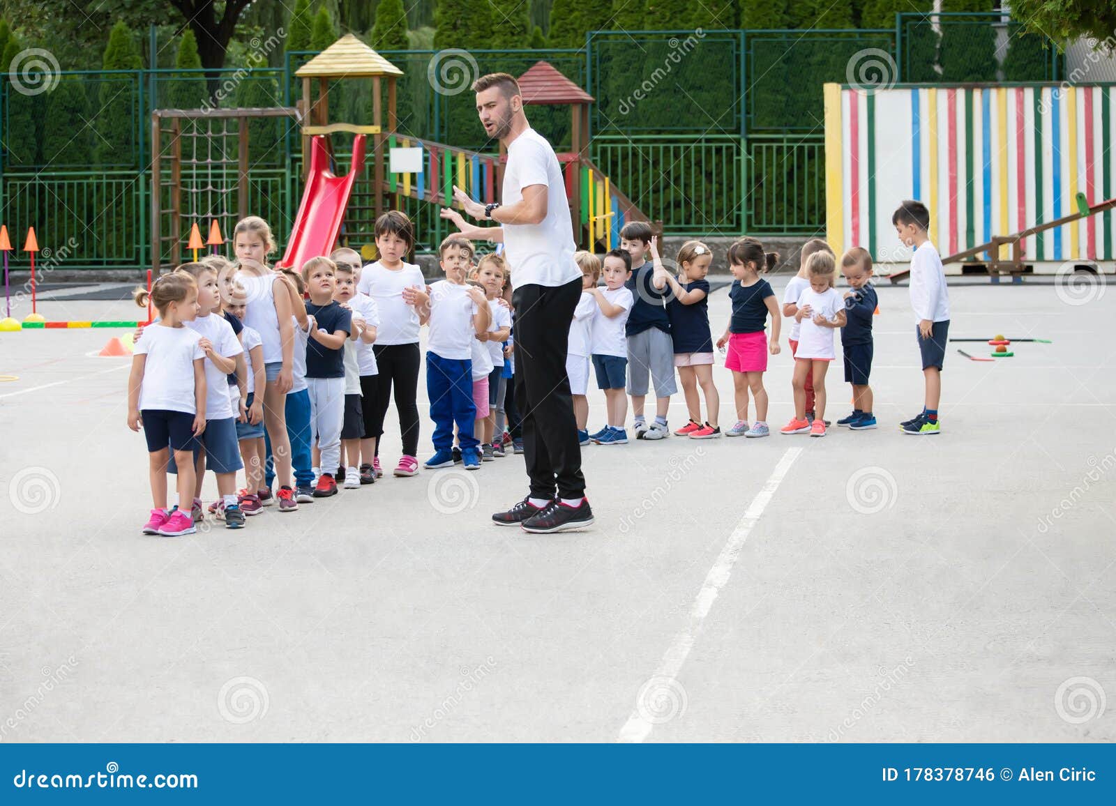 Group of Children Standing in Column and Waiting for Lesson Start ...