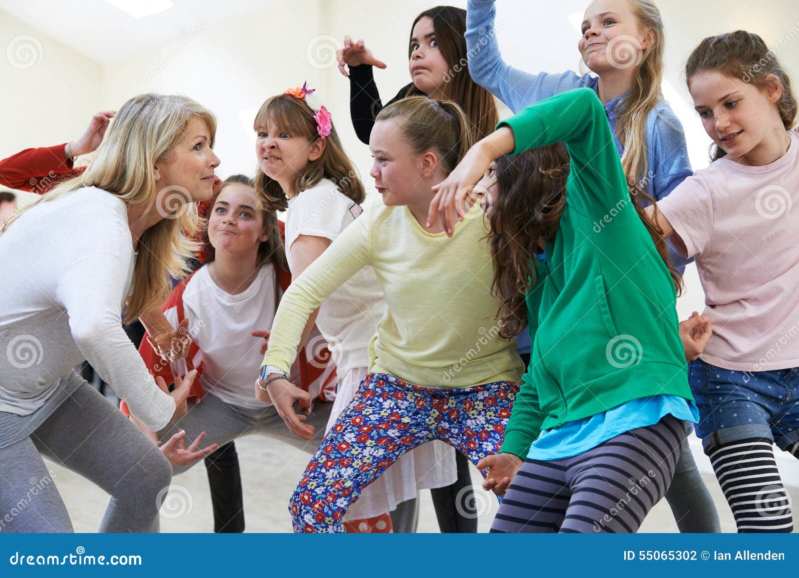 Group Of Children With Teacher Enjoying Drama Class Together Stock ...