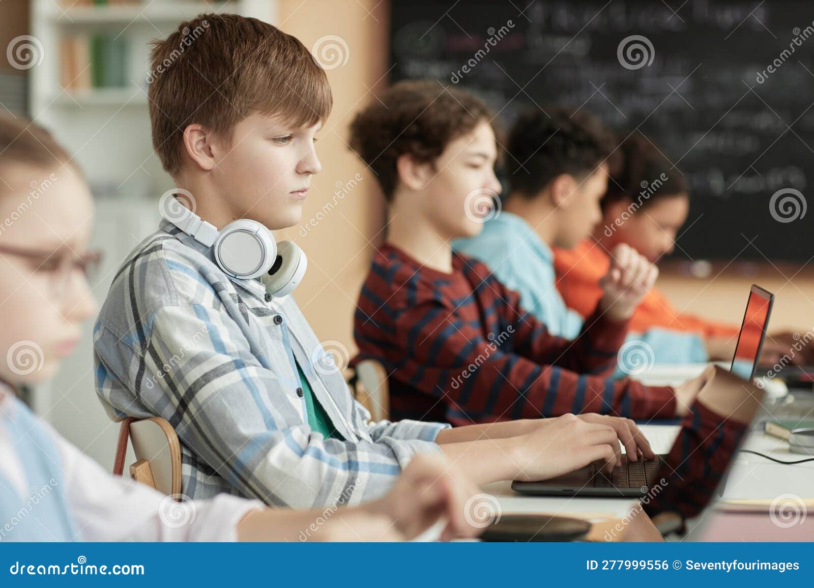 Group of Children Using Computers in Row in School Classroom Stock ...