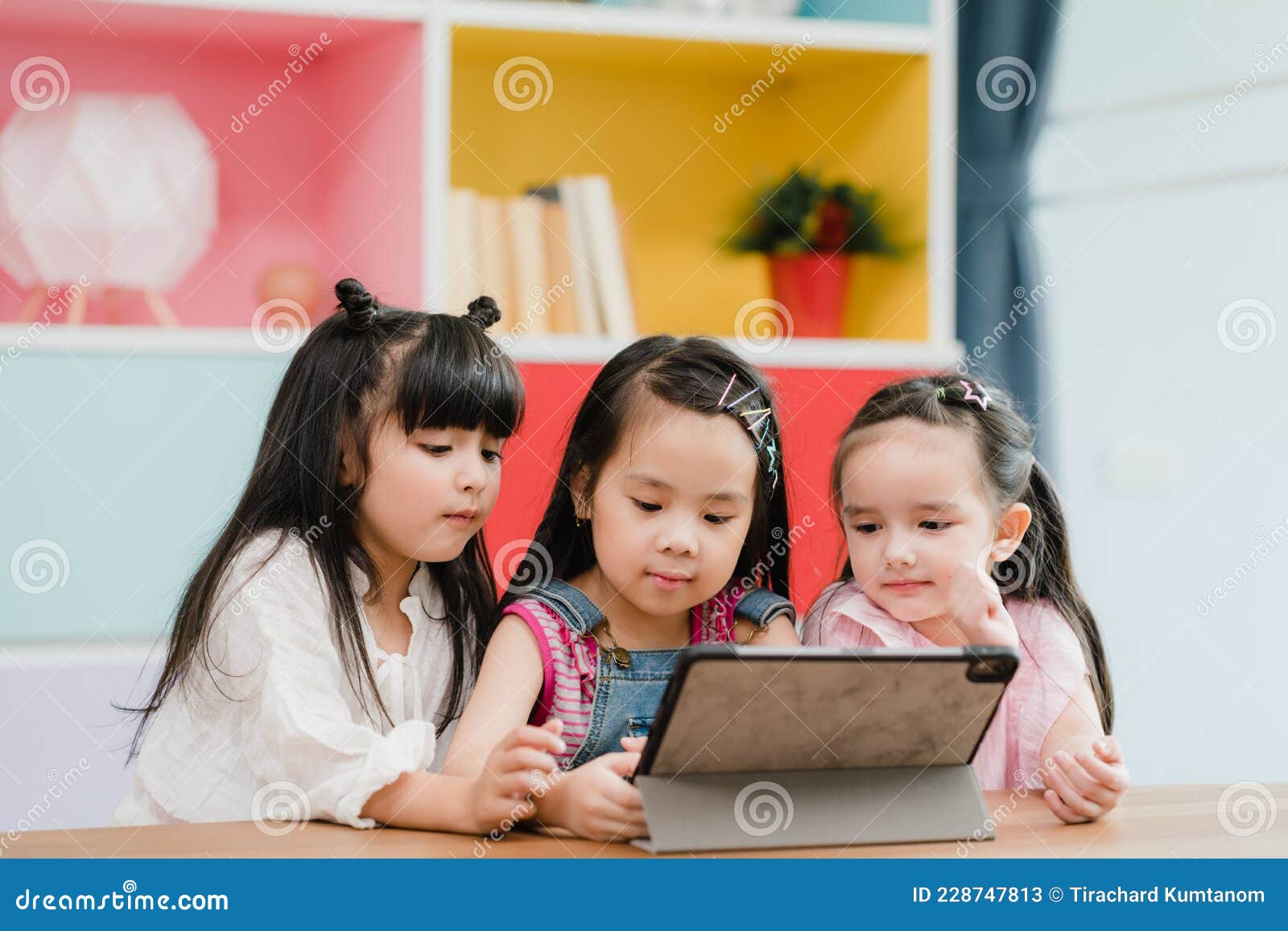 Group of Children Using Tablet in Classroom, Multi-ethnic Young Boys ...