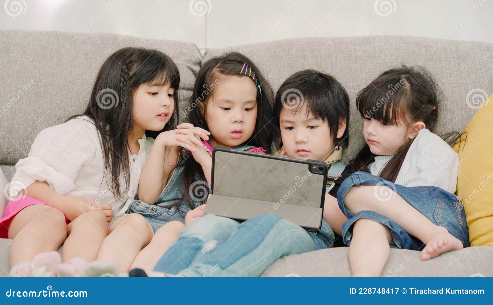 Group of Children Using Tablet in Classroom, Multi-ethnic Young Boys ...