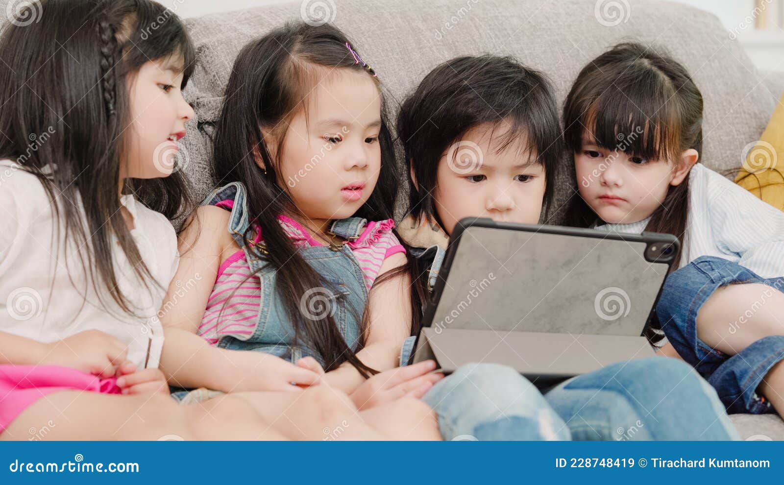 Group of Children Using Tablet in Classroom, Multi-ethnic Young Boys and Girls Happy Using ...