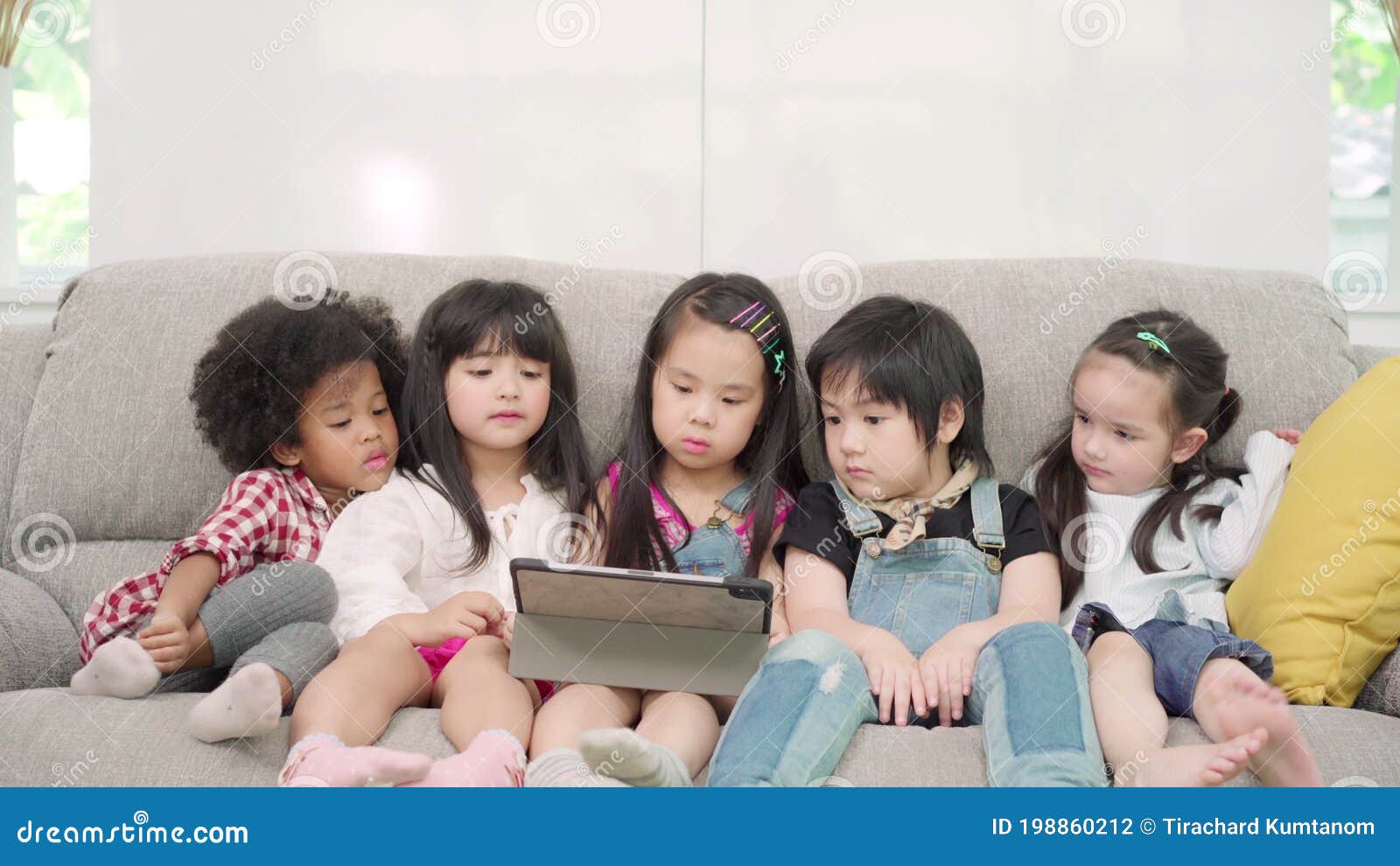 Group of Children Using Tablet in Classroom, Multi-ethnic Young Boys and Girls Happy Using ...