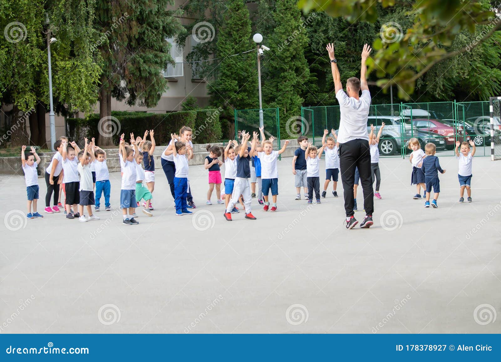 Group of Children Warming Up and Preparing for the Main Part of Lesson ...