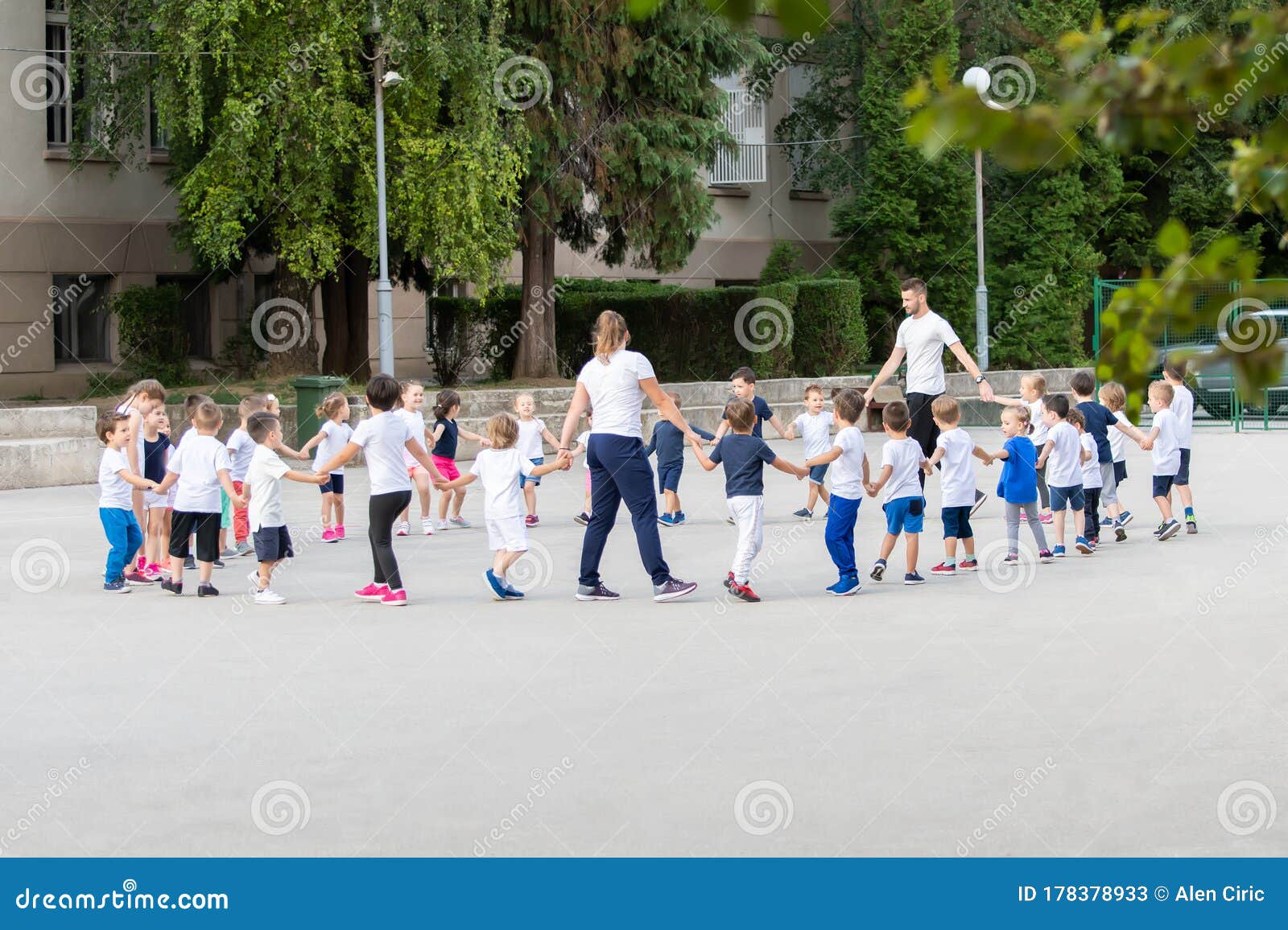 Group of Children Warming Up and Preparing for the Main Part of Lesson ...