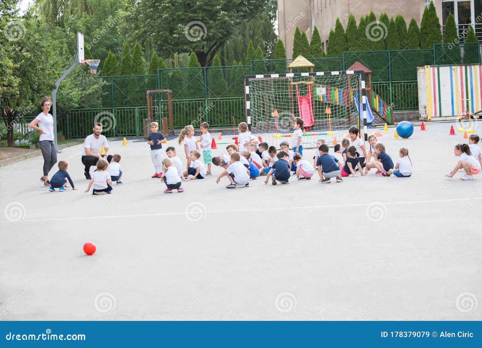 Group of Children Warming Up and Preparing for the Main Part of Lesson ...