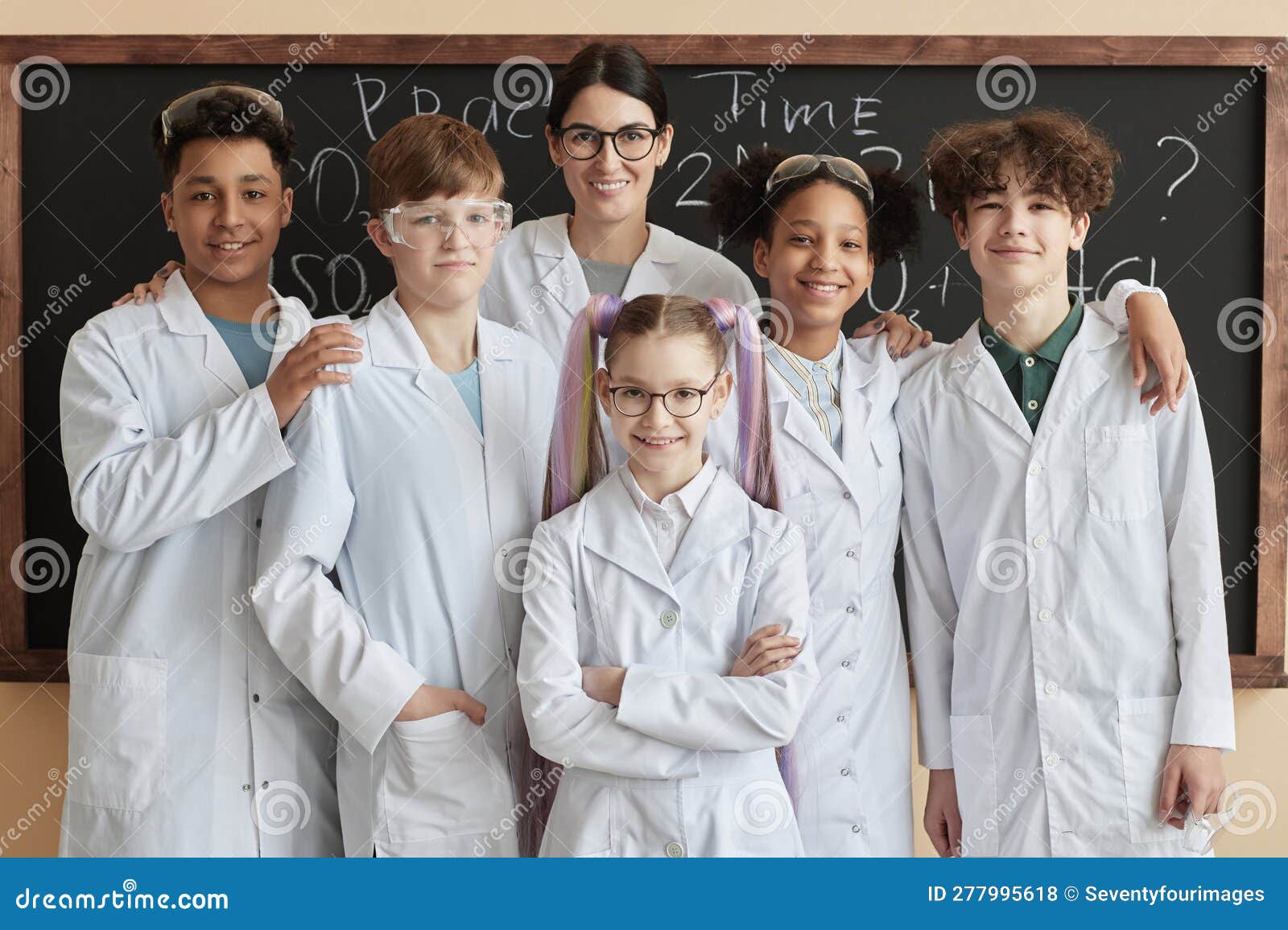 Group of Children Wearing Lab Coats in Science Class at School Smiling ...