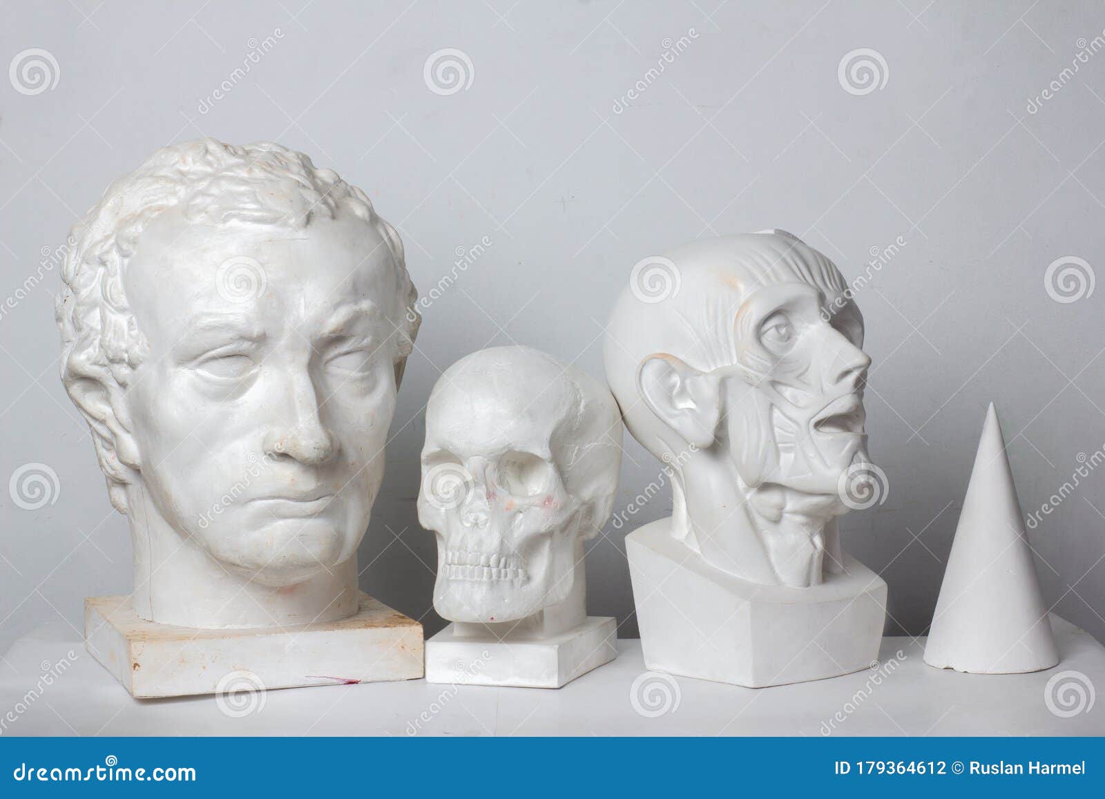 Group Classical Plaster Head Bust Against a White, Old, Worn Wall Stock ...