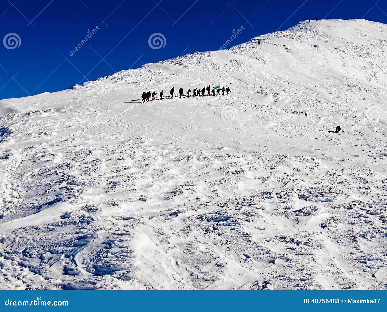 Group of Climbers Rises by the Snow-covered Mountain Stock Photo ...