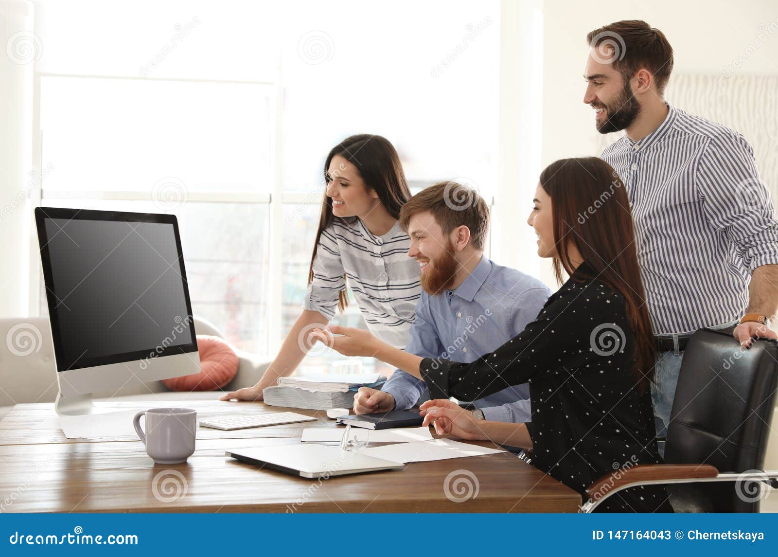 Group of Colleagues Using Video Chat on Computer in Office Stock Image ...