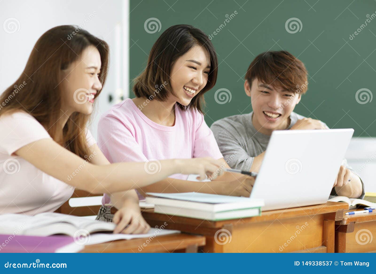 Group of College Student Discussing in Classroom Stock Image - Image of ...