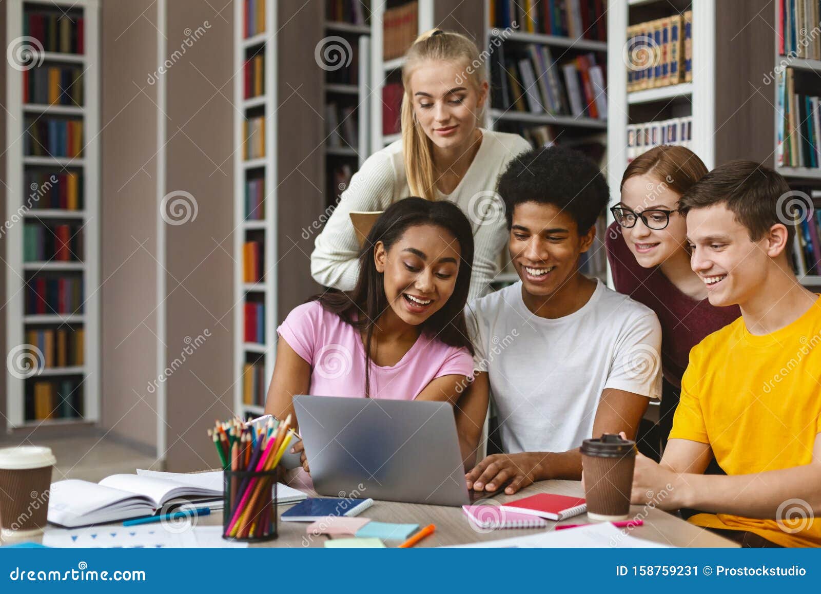 Group of College Students Checking on New Project Stock Image - Image ...