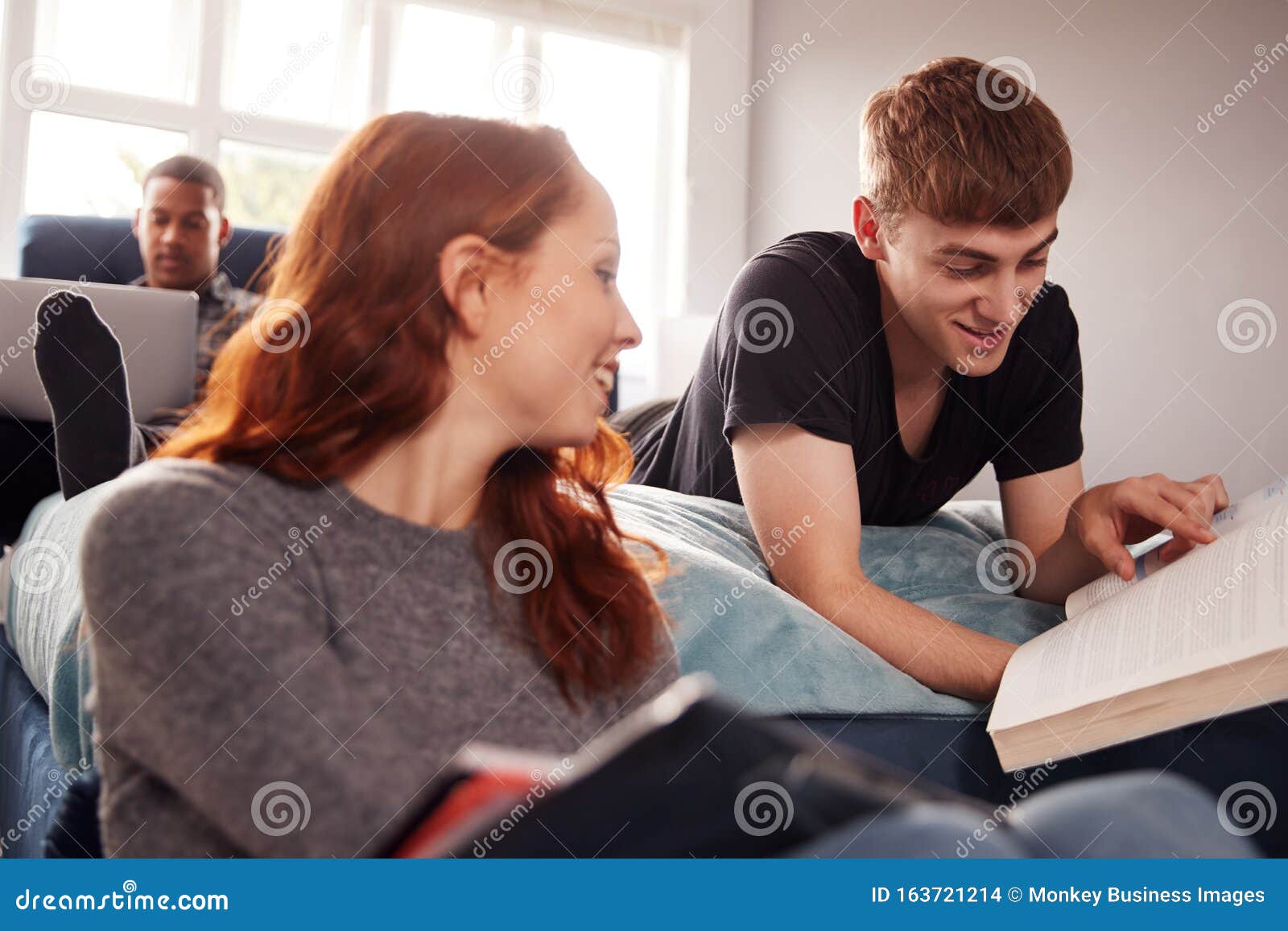Group of College Students in Shared House Bedroom Studying Together ...