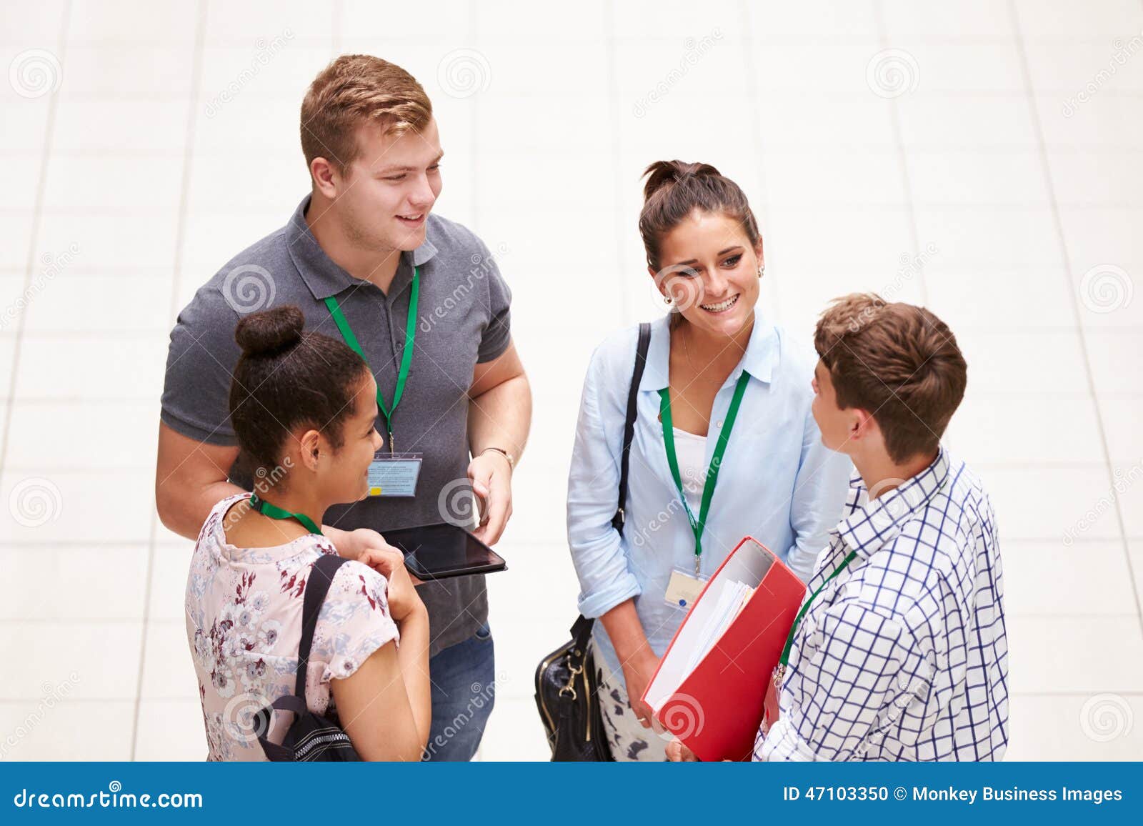 Group of College Students Standing in Hallway Talking Stock Photo ...