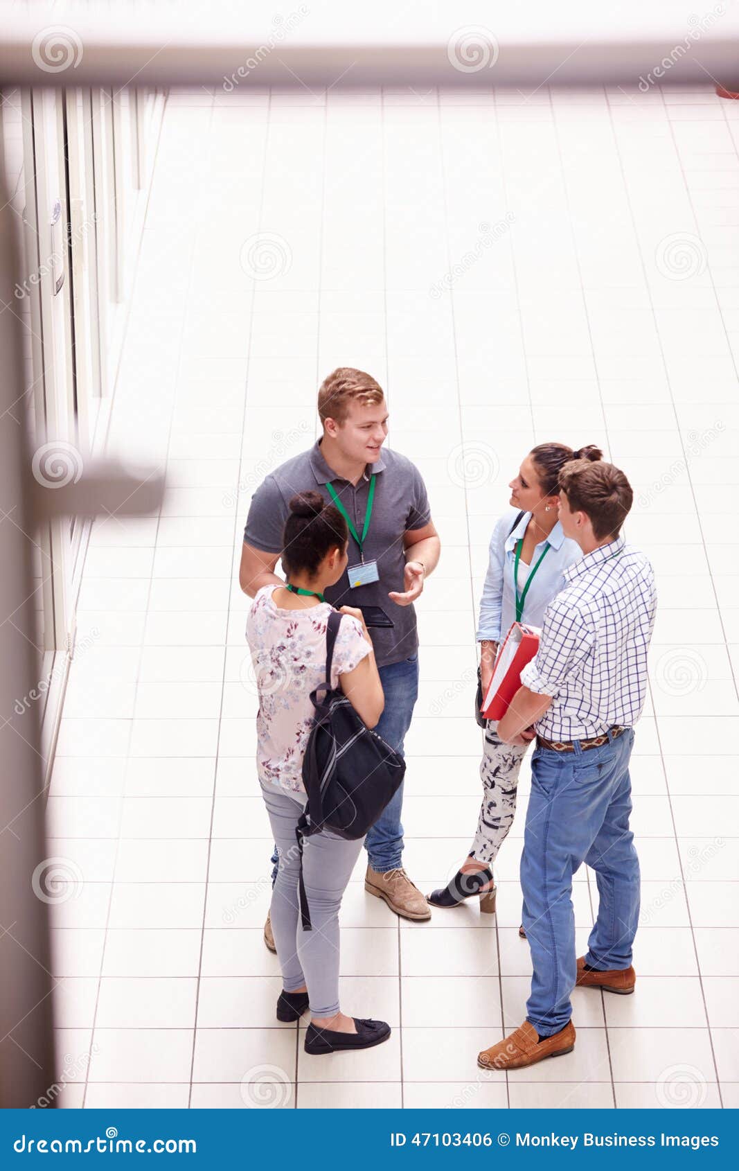Group of College Students Standing in Hallway Talking Stock Photo ...