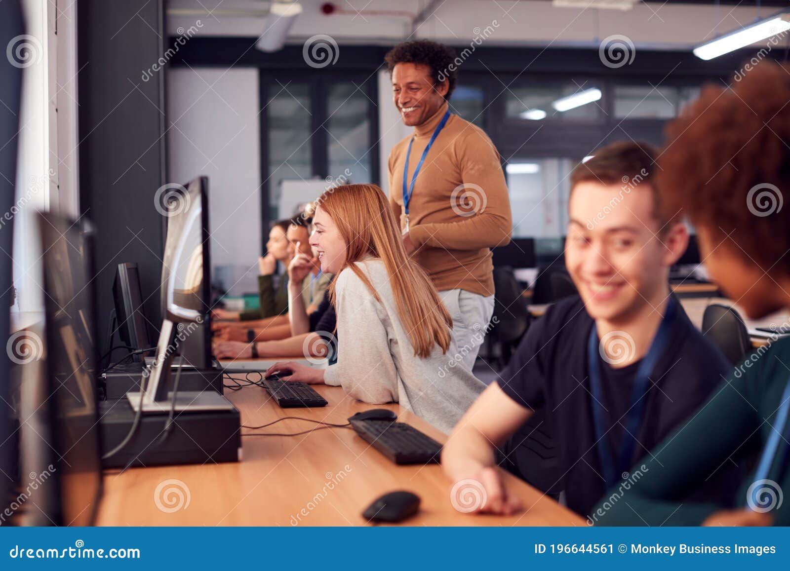 Group of College Students with Tutor Studying Computer Design Sitting ...