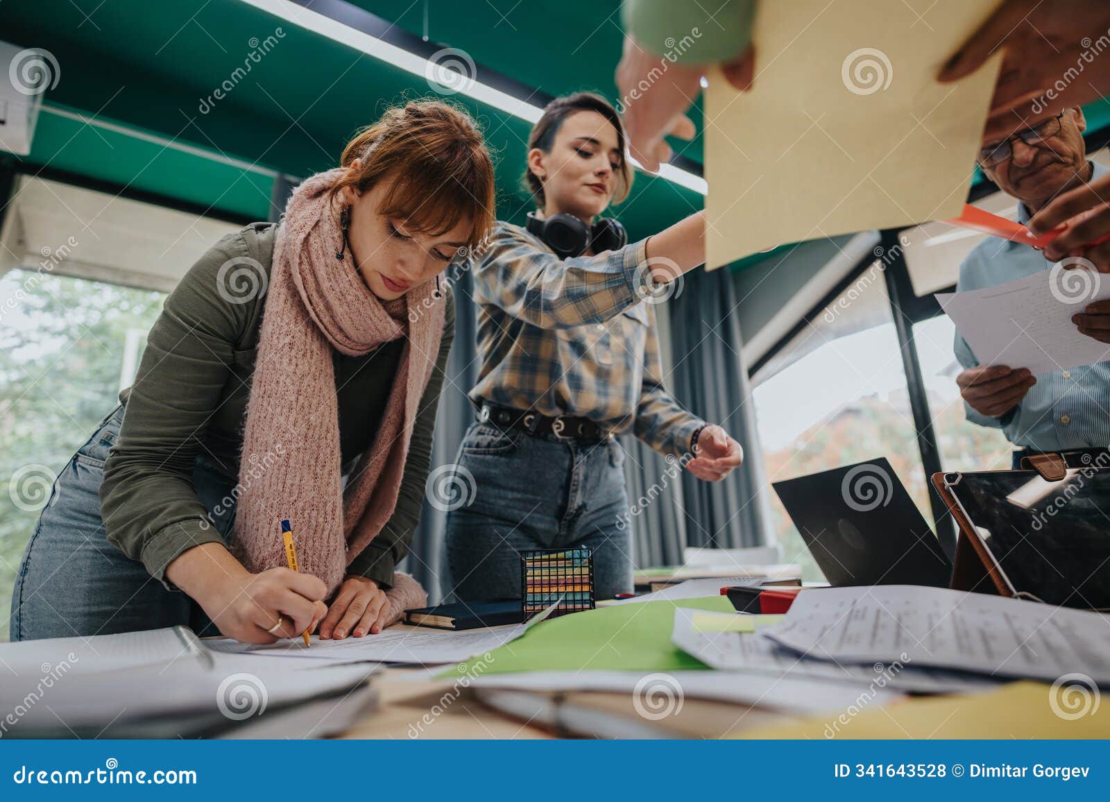 College Students Collaborating with Professor in Modern Classroom ...
