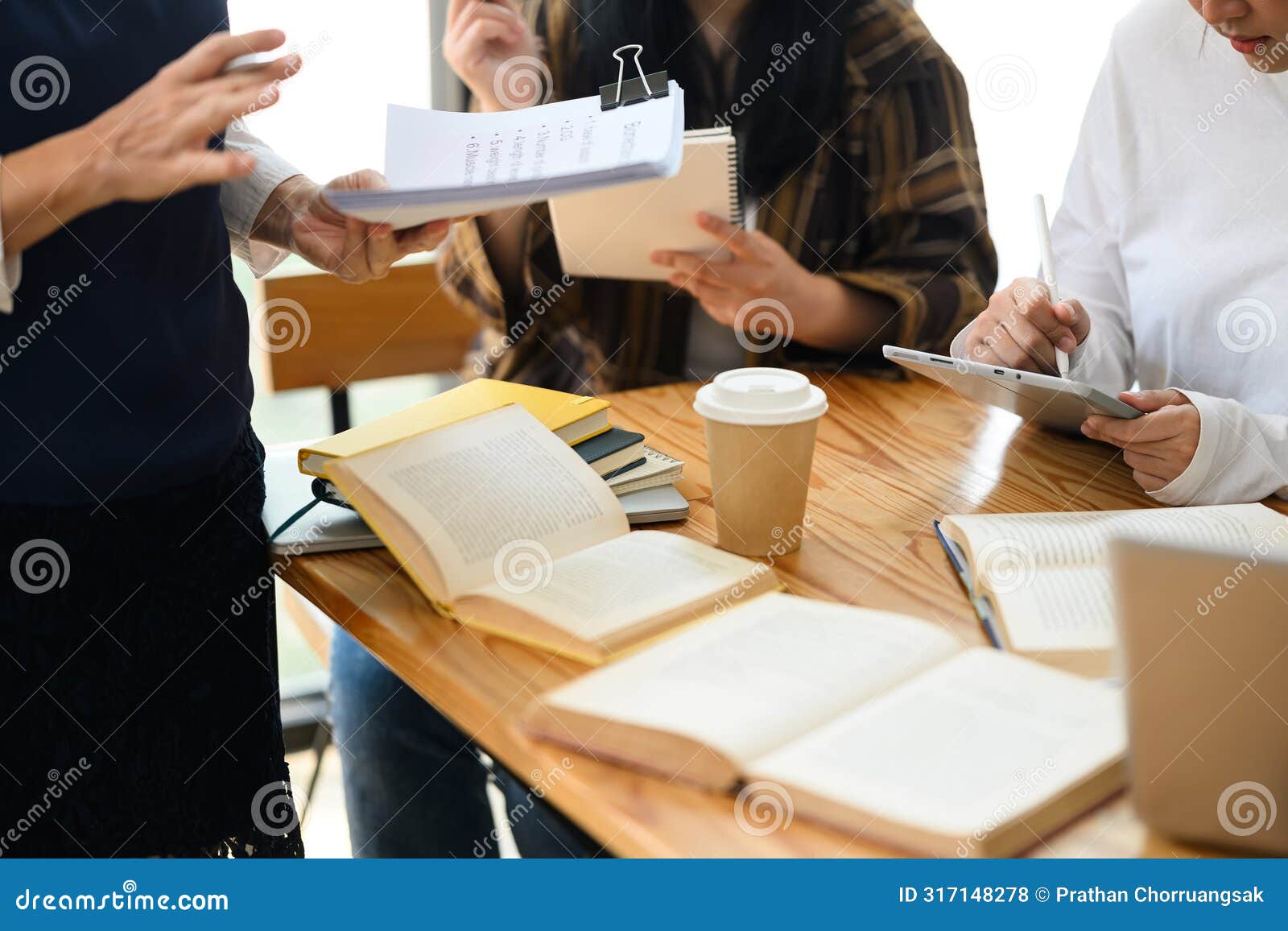 Group of College Students Working Together for Their Project at Table ...