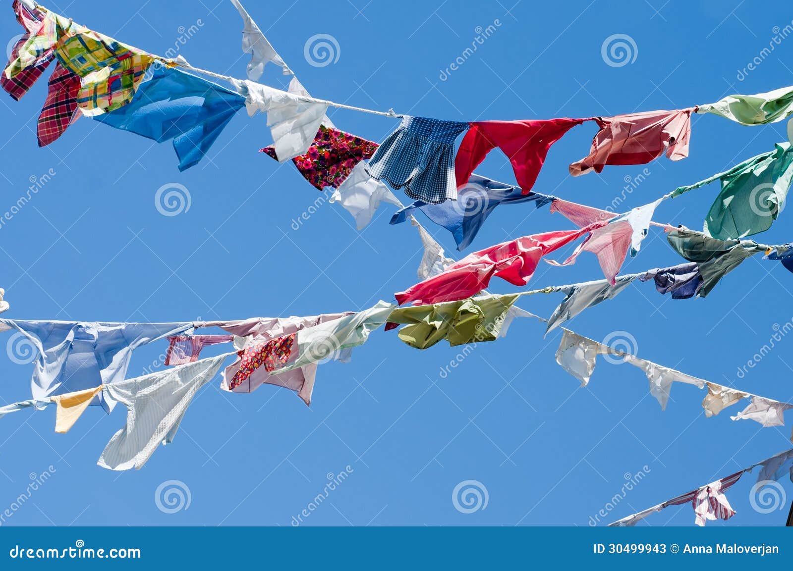 A Group of Colored Shirts on a Clothesline Stock Image - Image of ...