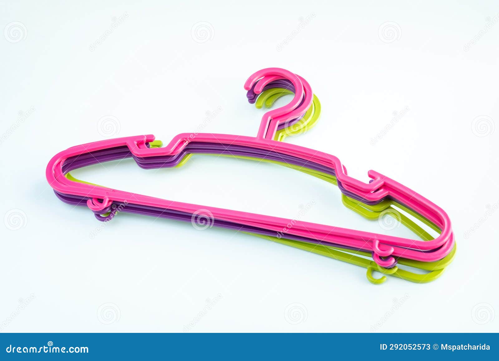 A Group of Colorful Plastic Hangers on White Background Stock Image ...