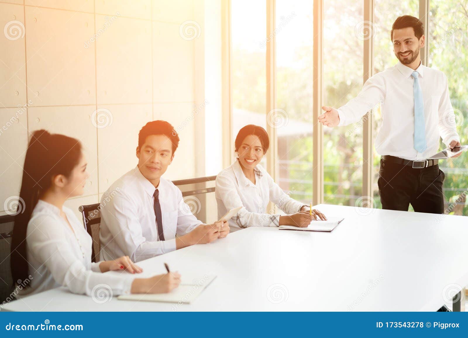 Group of Confident Business People Analyzing and Discussion Data in the ...