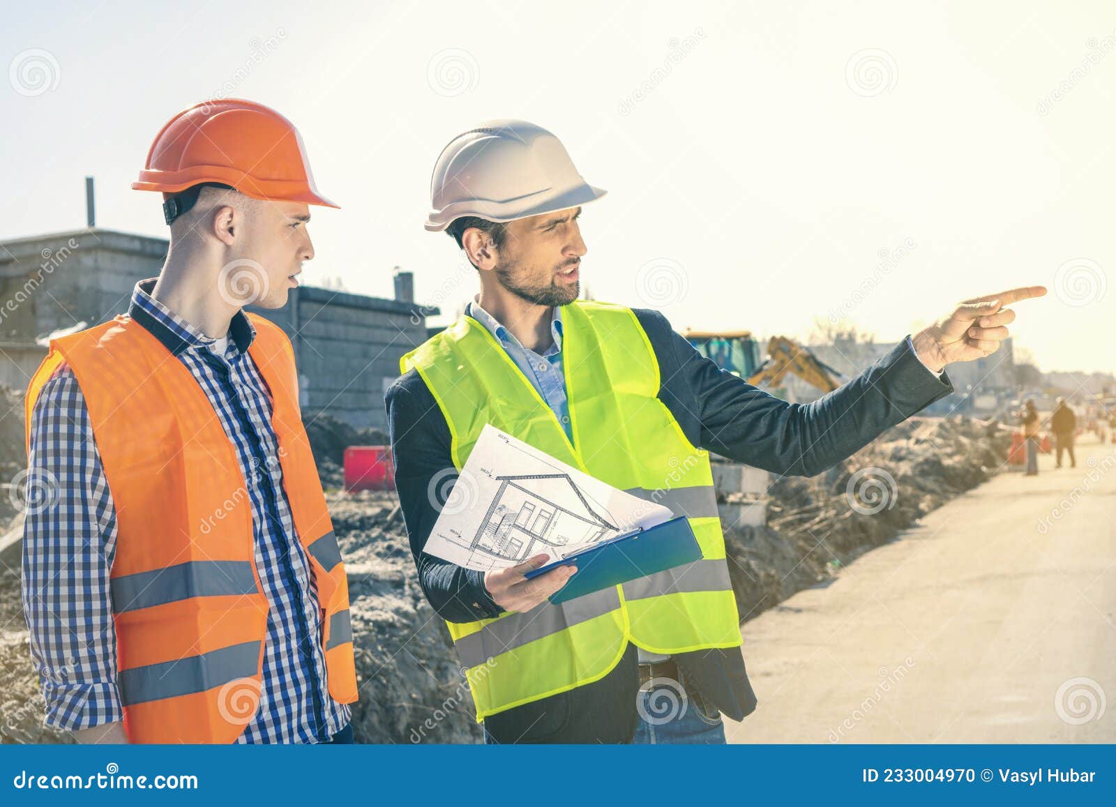 Group of Construction Engineers on a Building Plot. Real Estate Project ...