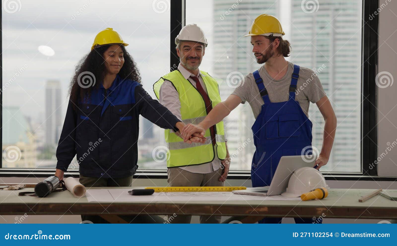 Group of Construction Engineers Touching and Stacking Hands Supporting ...