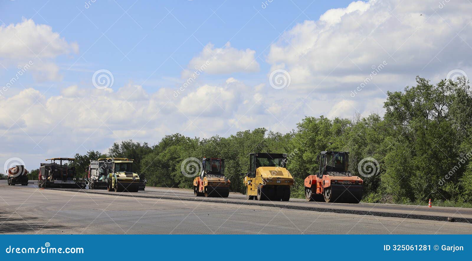 A Group of Construction Vehicles are Lined Up on a Road Stock Image ...