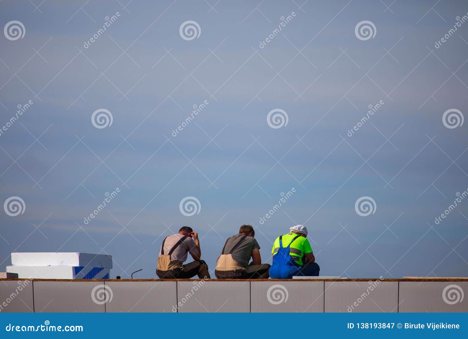 Group of Construction Workers on a Break Stock Image - Image of three ...