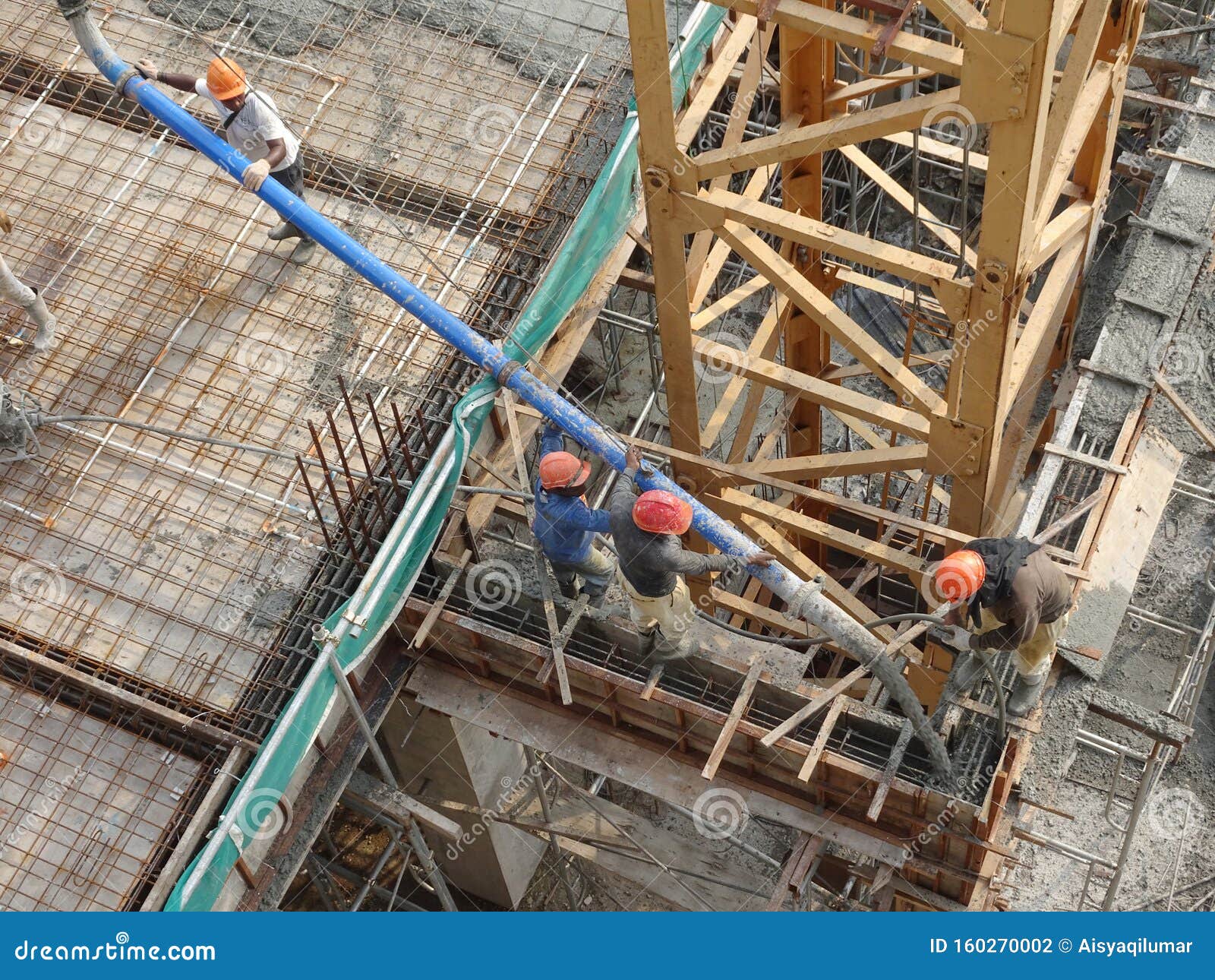 Group of Construction Workers Pouring Wet Concrete Using the Concrete ...