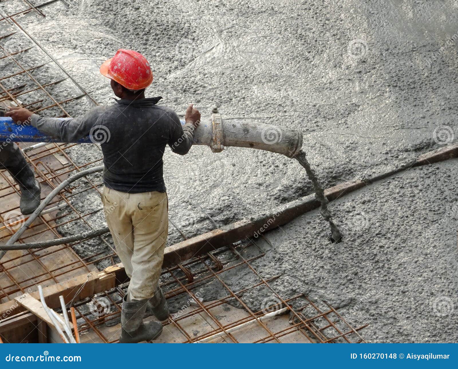 Group of Construction Workers Pouring Wet Concrete Using the Concrete ...