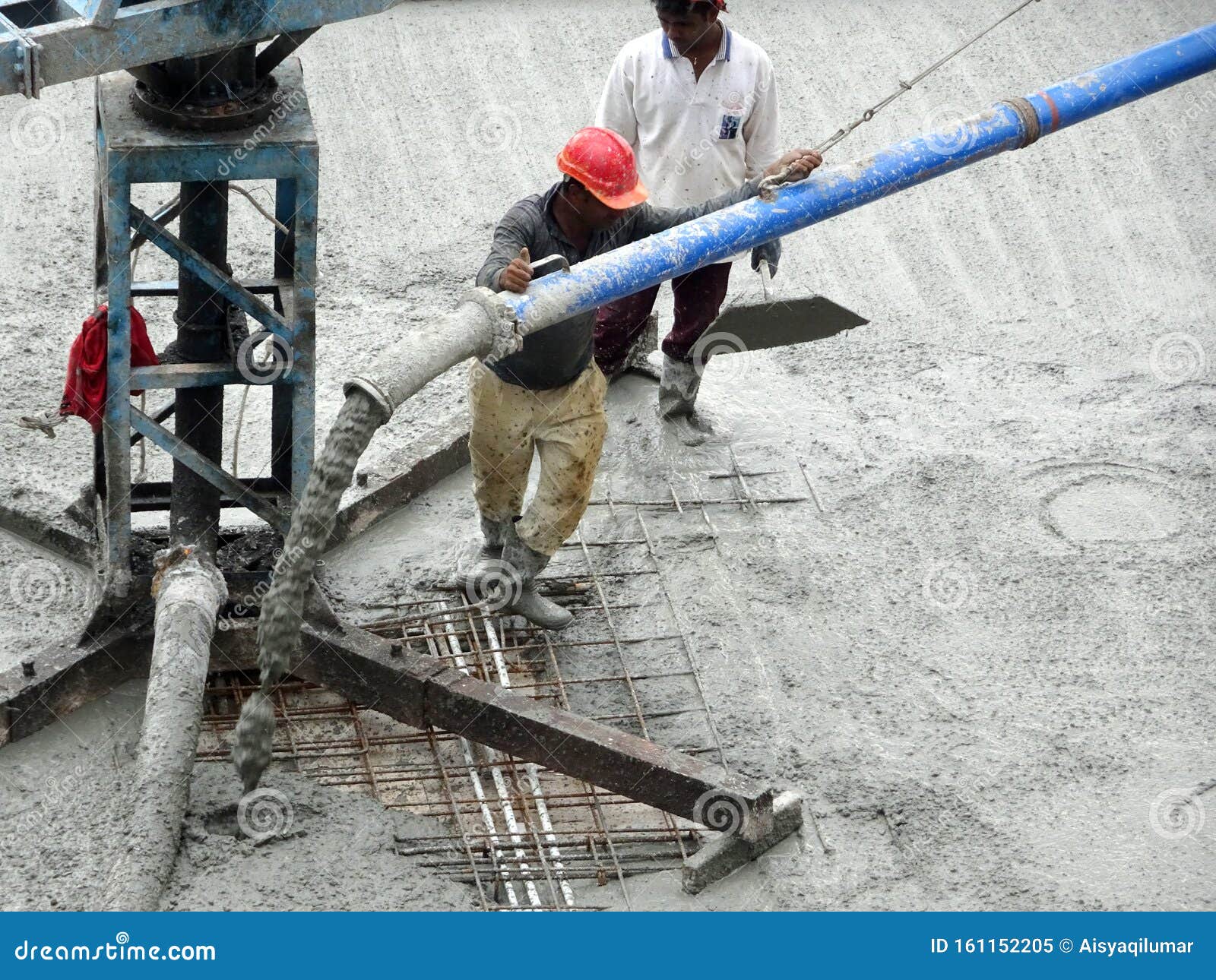Group of Construction Workers Pouring Wet Concrete Using the Concrete ...