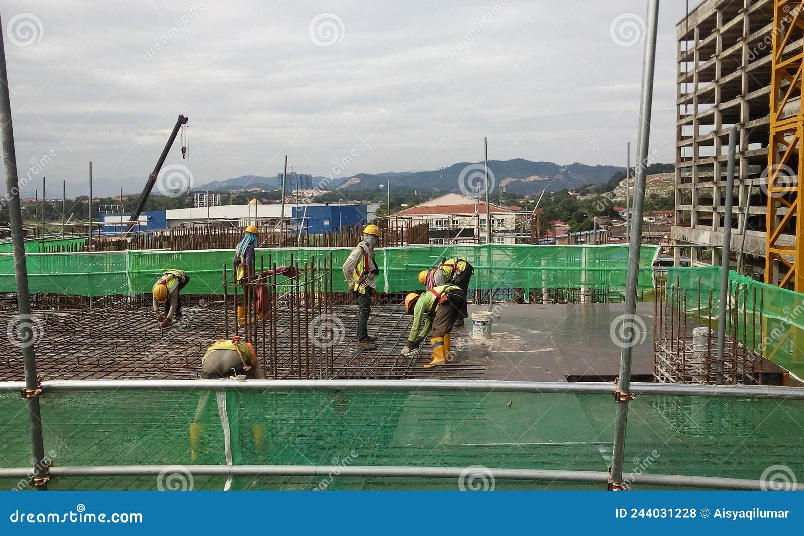 Group of Construction Workers Working at the Construction Site. the ...