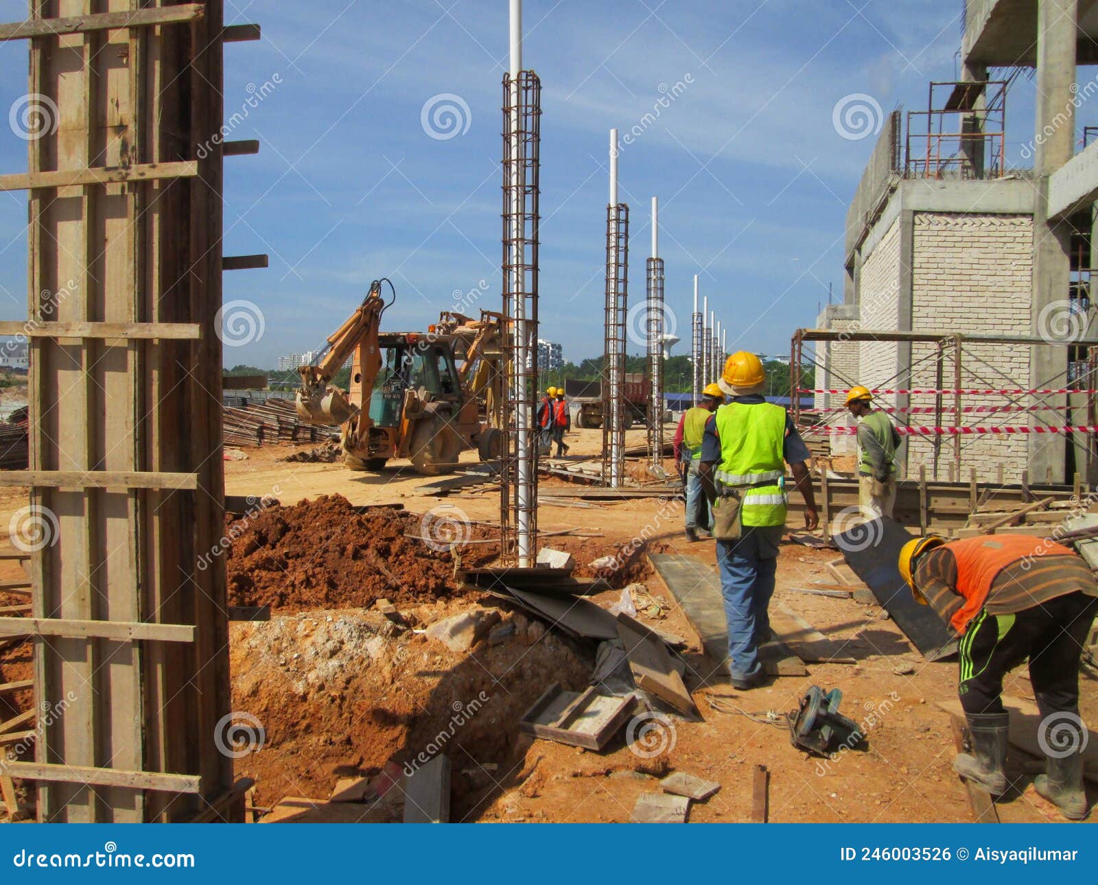 A Group of Construction Workers is Working at a Construction Site ...