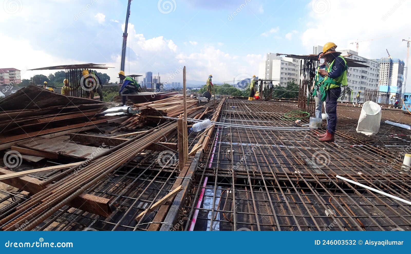 A Group of Construction Workers is Working at a Construction Site ...