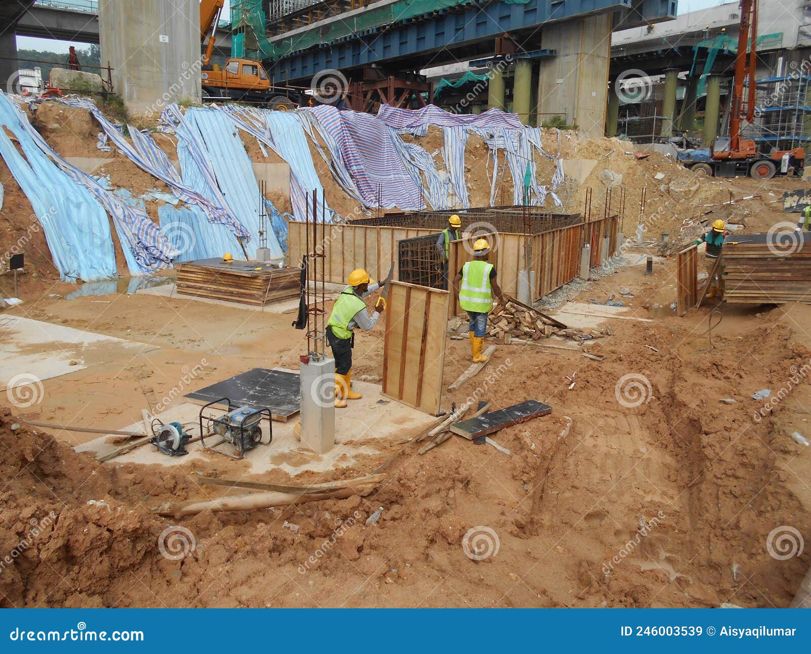 A Group of Construction Workers is Working at a Construction Site ...