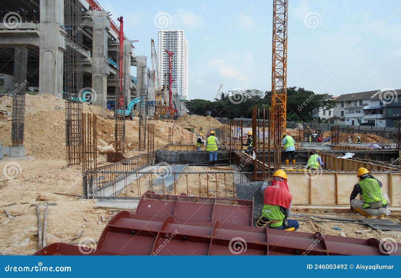A Group of Construction Workers is Working at a Construction Site ...